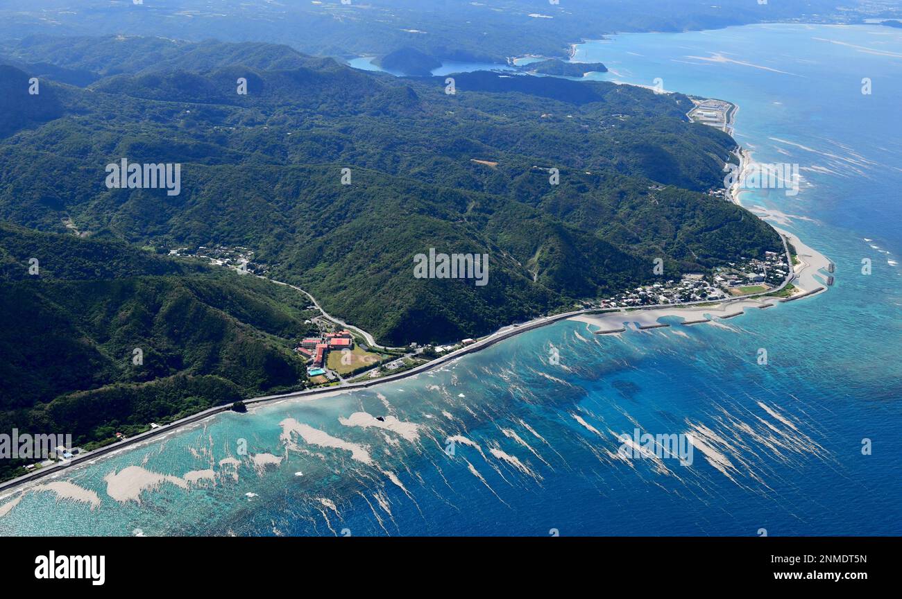 An aerial photo shows sea shore covered with a large volume of pumice ...