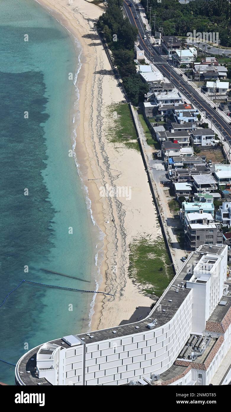 An aerial photo shows a seashore covered with a large volume of pumice ...