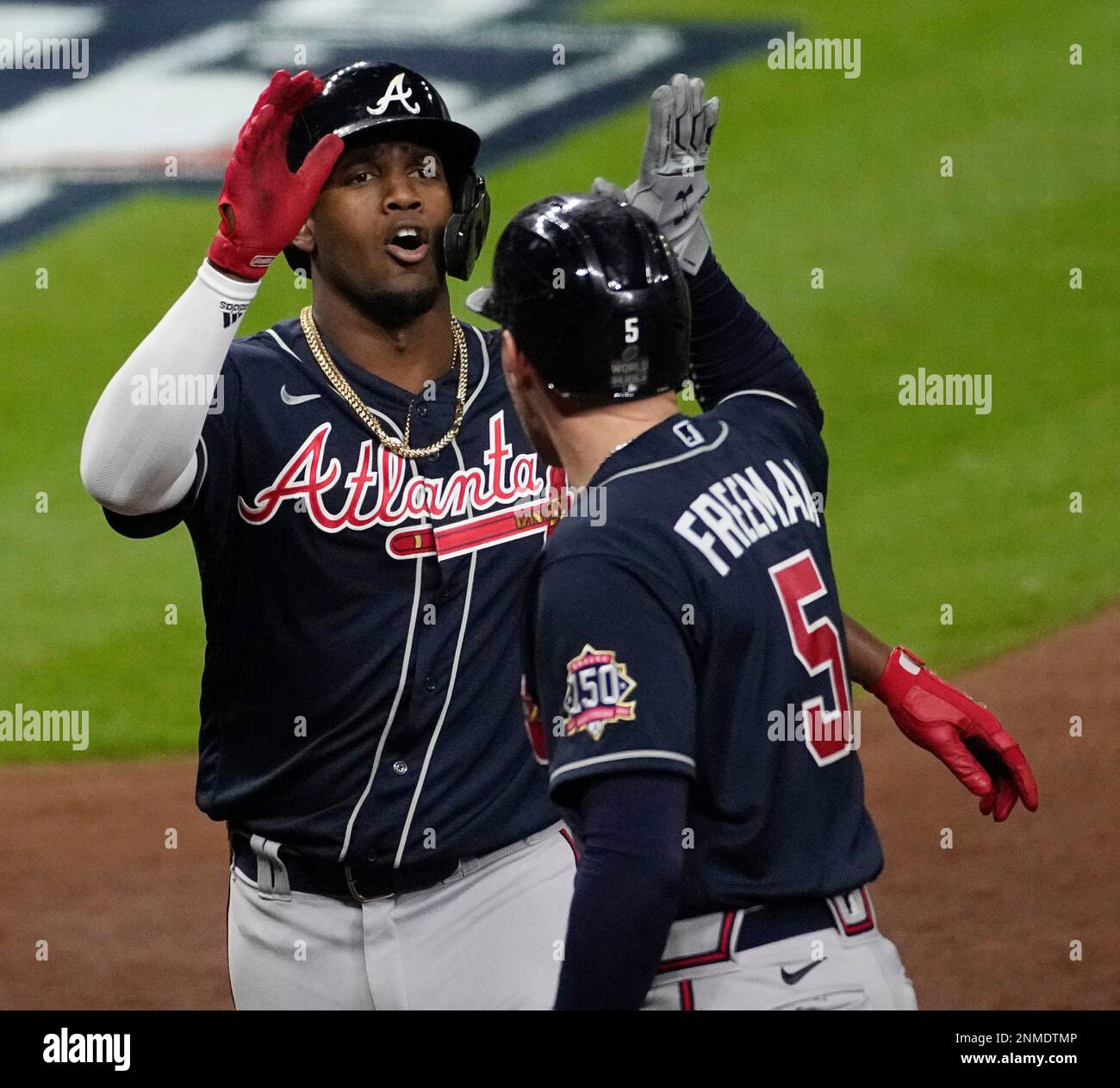 Atlanta Braves designated hitter Jorge Soler celebrates with Freddie ...
