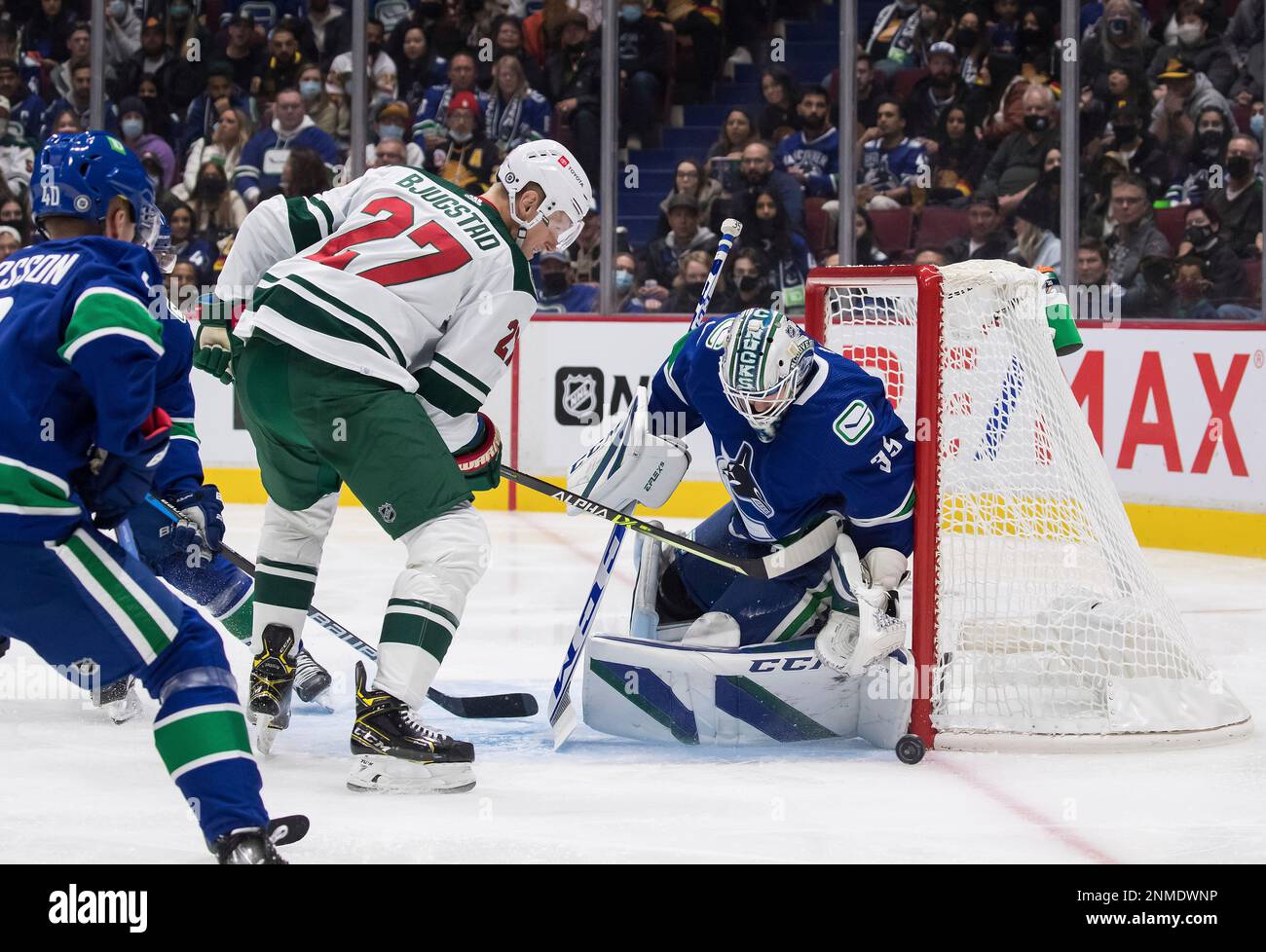 Vancouver Canucks goalie Thatcher Demko (35) stops Minnesota Wild's ...
