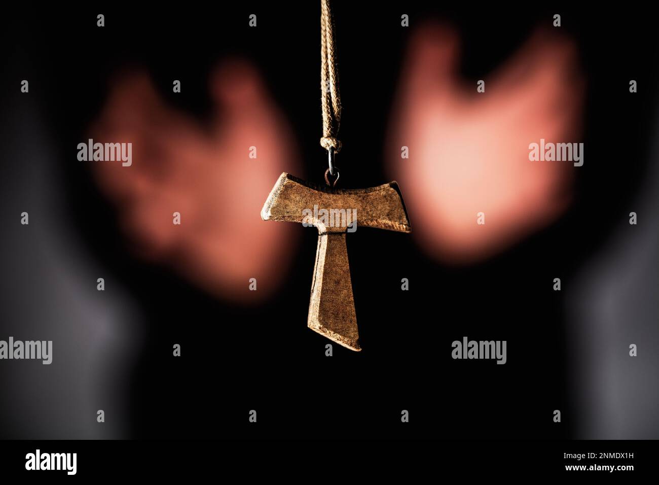 Wooden crucifix and hands for mercy Stock Photo - Alamy