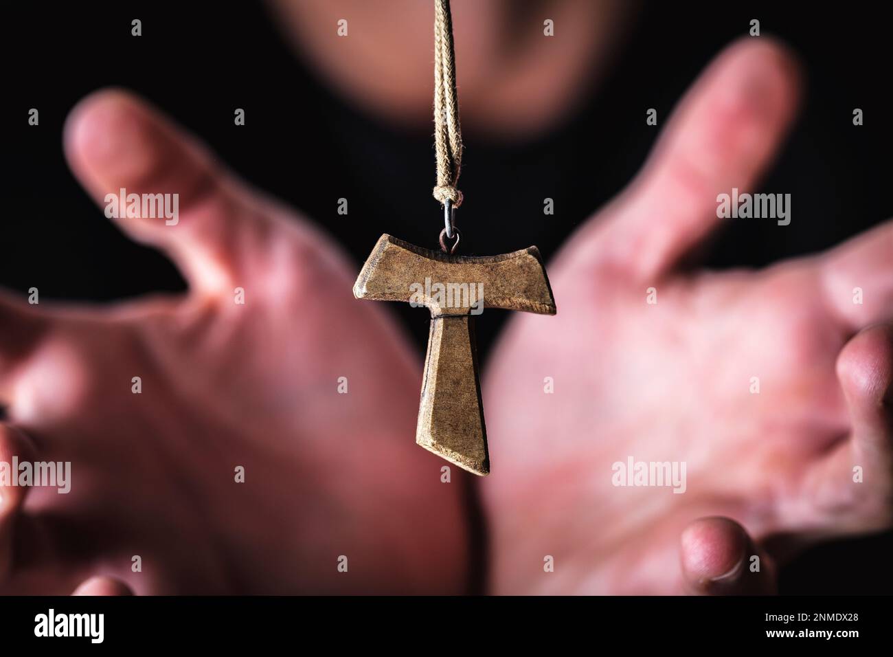 Wooden crucifix and hands for mercy Stock Photo - Alamy