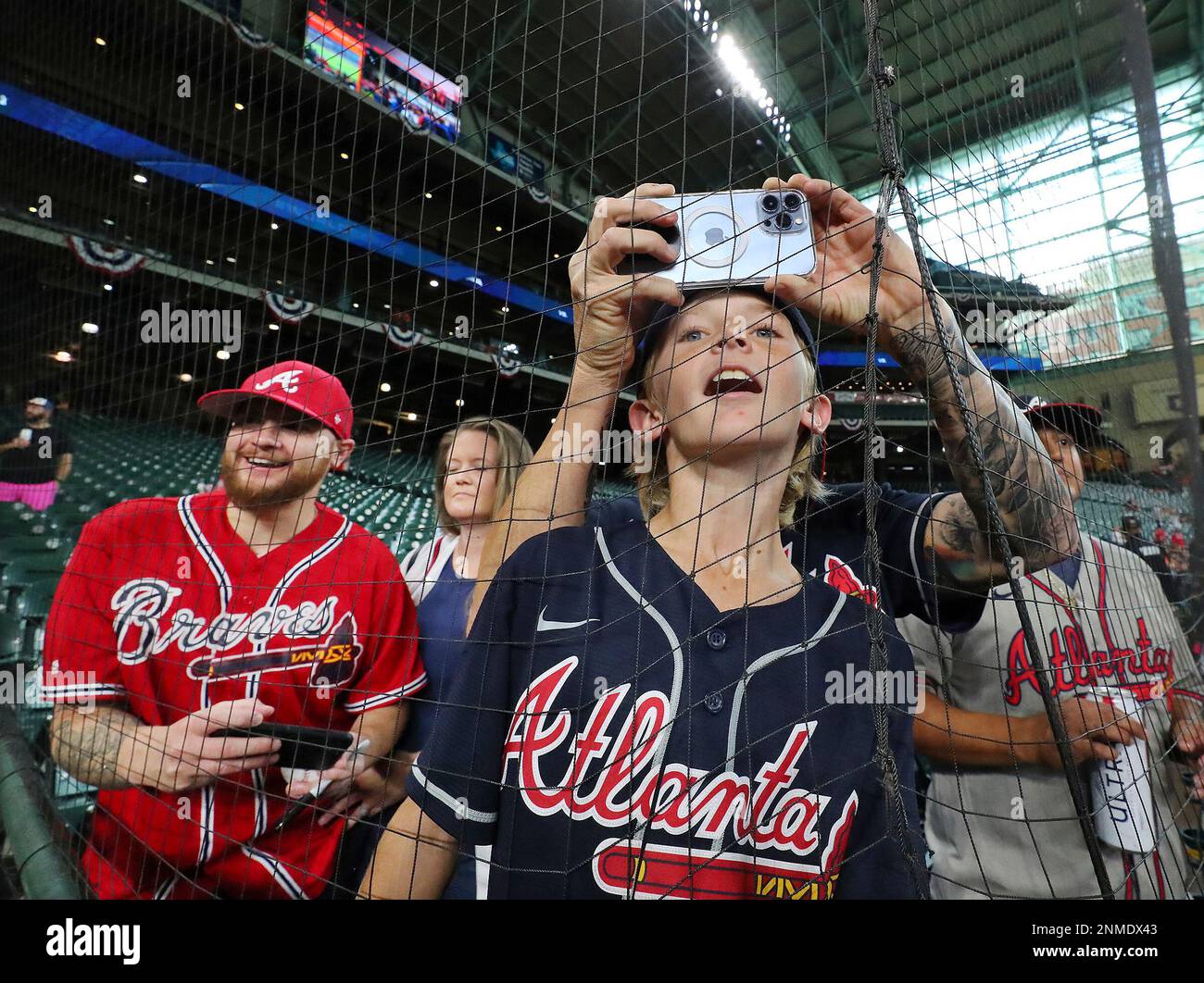 Atlanta Braves fan Ed Heyward snaps a photo of Freddie Freeman while ...