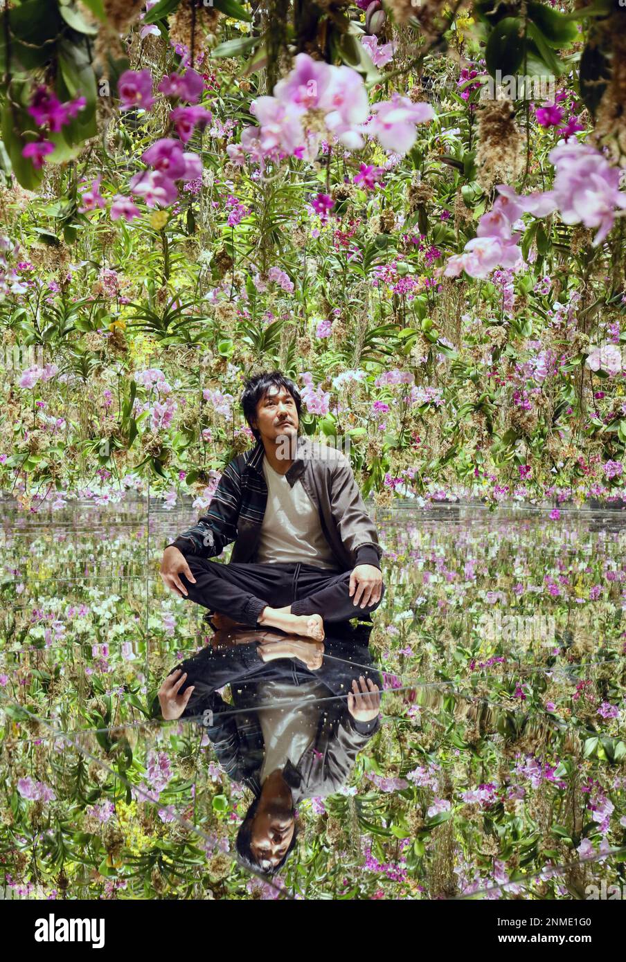 Toshiyuki Inoko poses for a photo amid an art work Floating Flower ...
