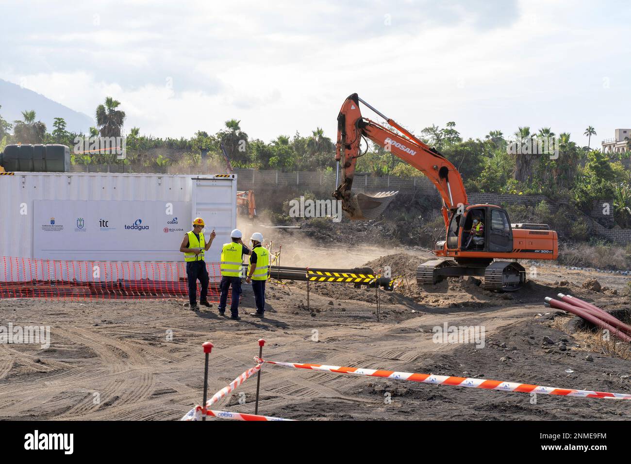 Operators work on the installation of water mixing tanks for the ...
