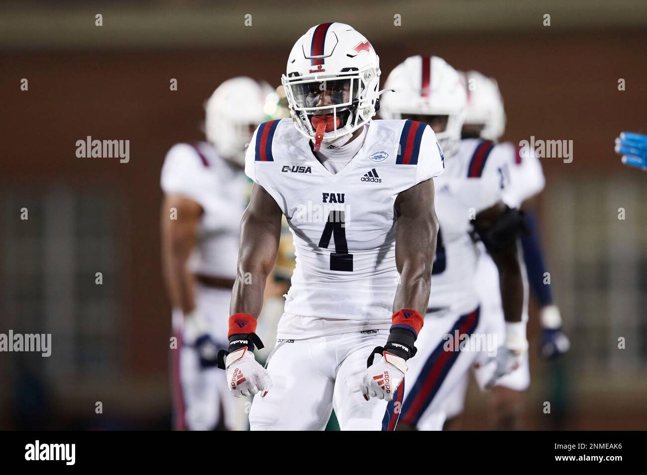 Florida Atlantic Owls safety Teja Young (4) flexes his muscles after ...