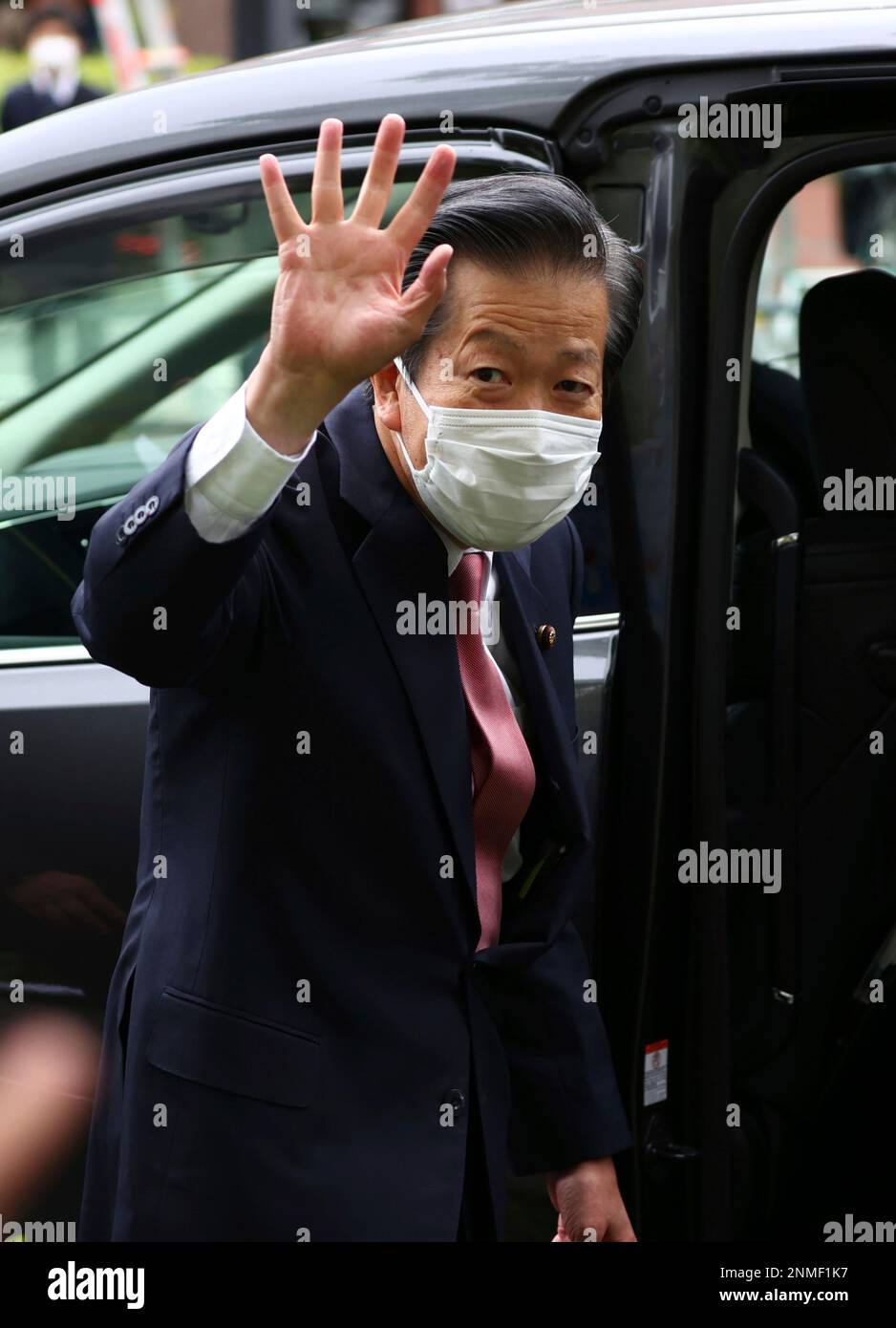 Natsuo Yamaguchi, Komeito leader,waves his hand after waving a street ...