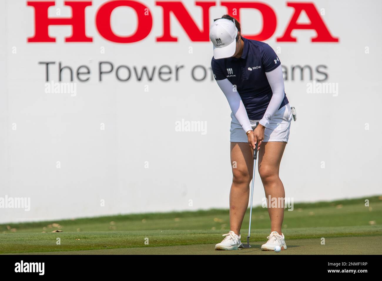Lin Xiyu Janet of China putts on the 18st hole green at Siam Country ...