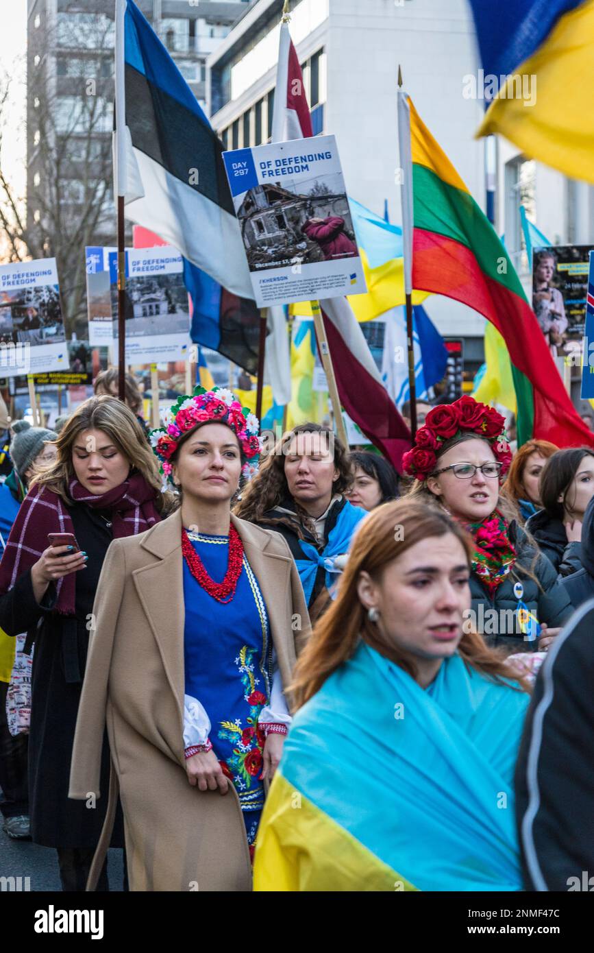 Woman with a wreath of red flowers at the 'Heartbroken but Unbroken ...