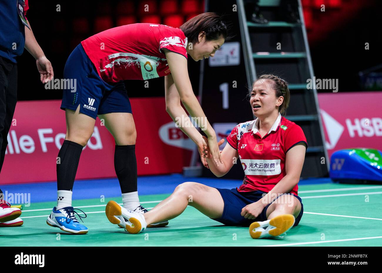 China's Mod Chen Qing Chen, right, reacts after she and teammate Jia Yi ...