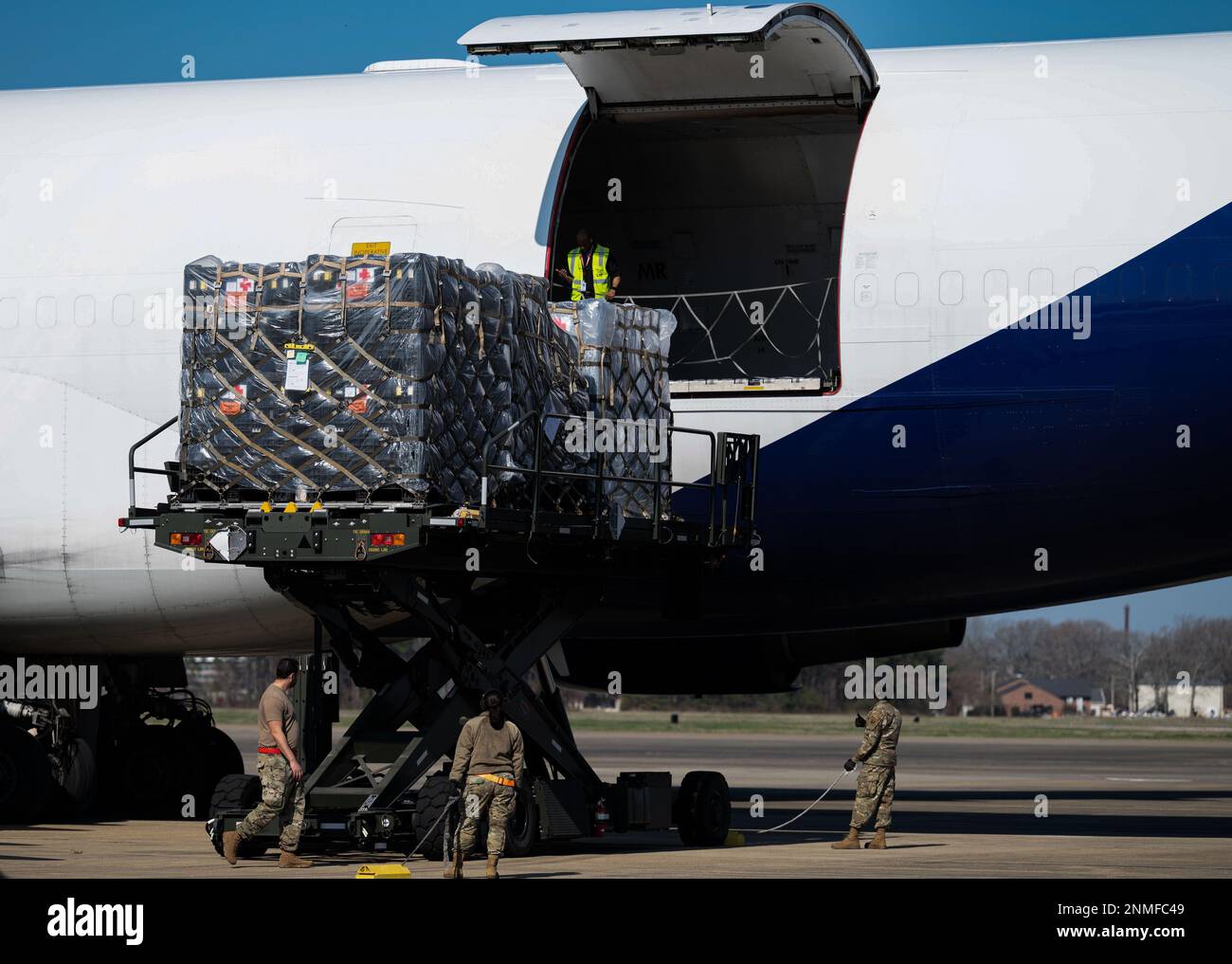 Medical supply pallets are loaded onto a Boeing 747-400 for transport ...