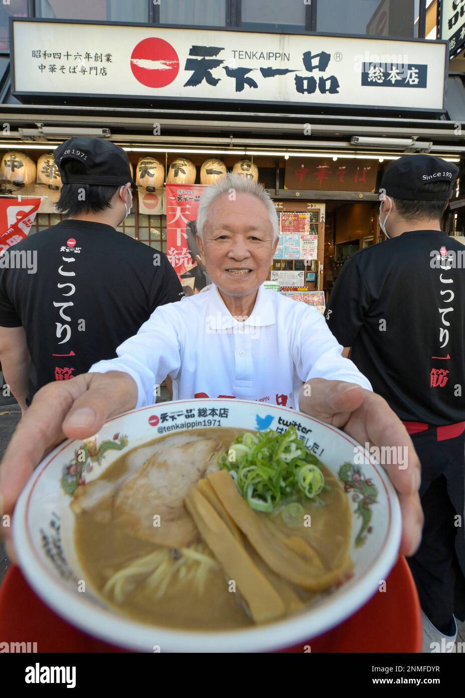TsutomuKimura, the founder and the president of Tenkaippin, holds ...