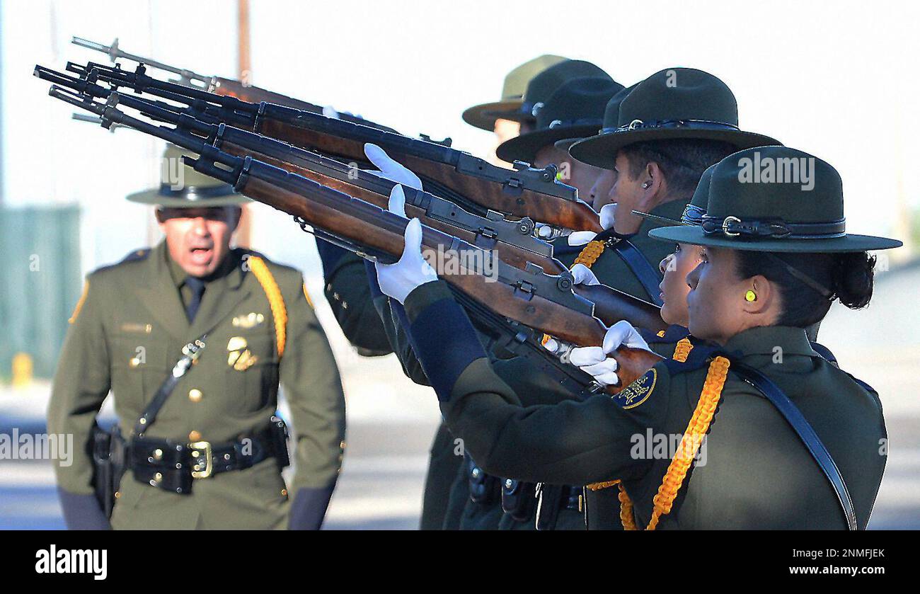 The U.S. Border Patrol Yuma Sector Honor Guard fires a 21-gun salute ...