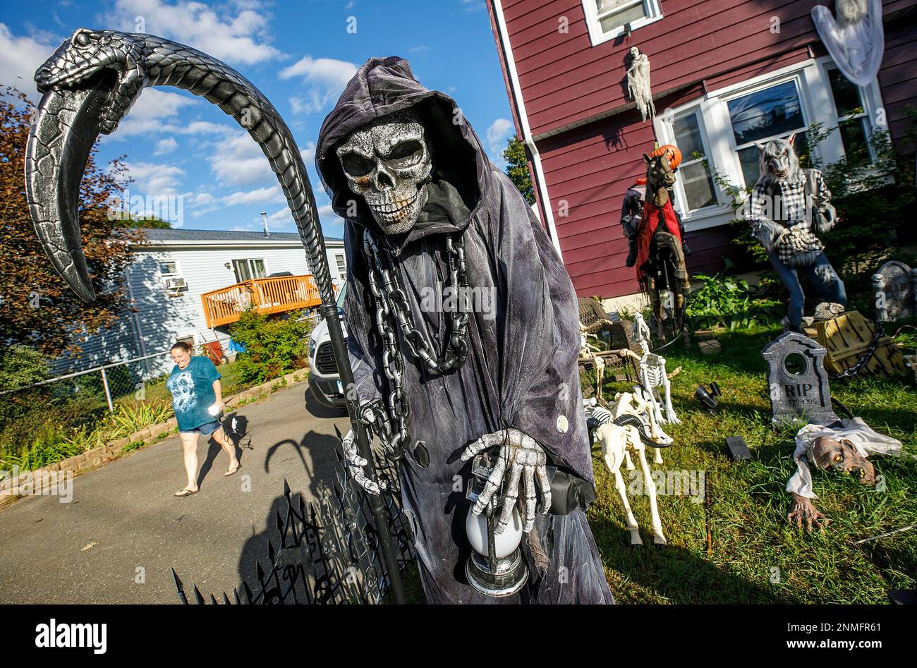 Chrystal Rashba, of Wallingford, walks by one of the many ghouls her ...