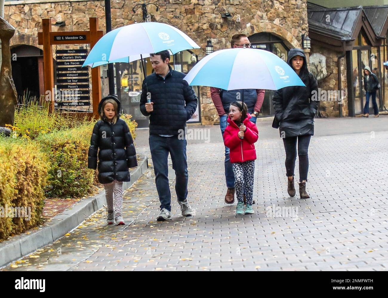 Eric Eichler of Denver walks with his two daughters, Annie, 6, right ...