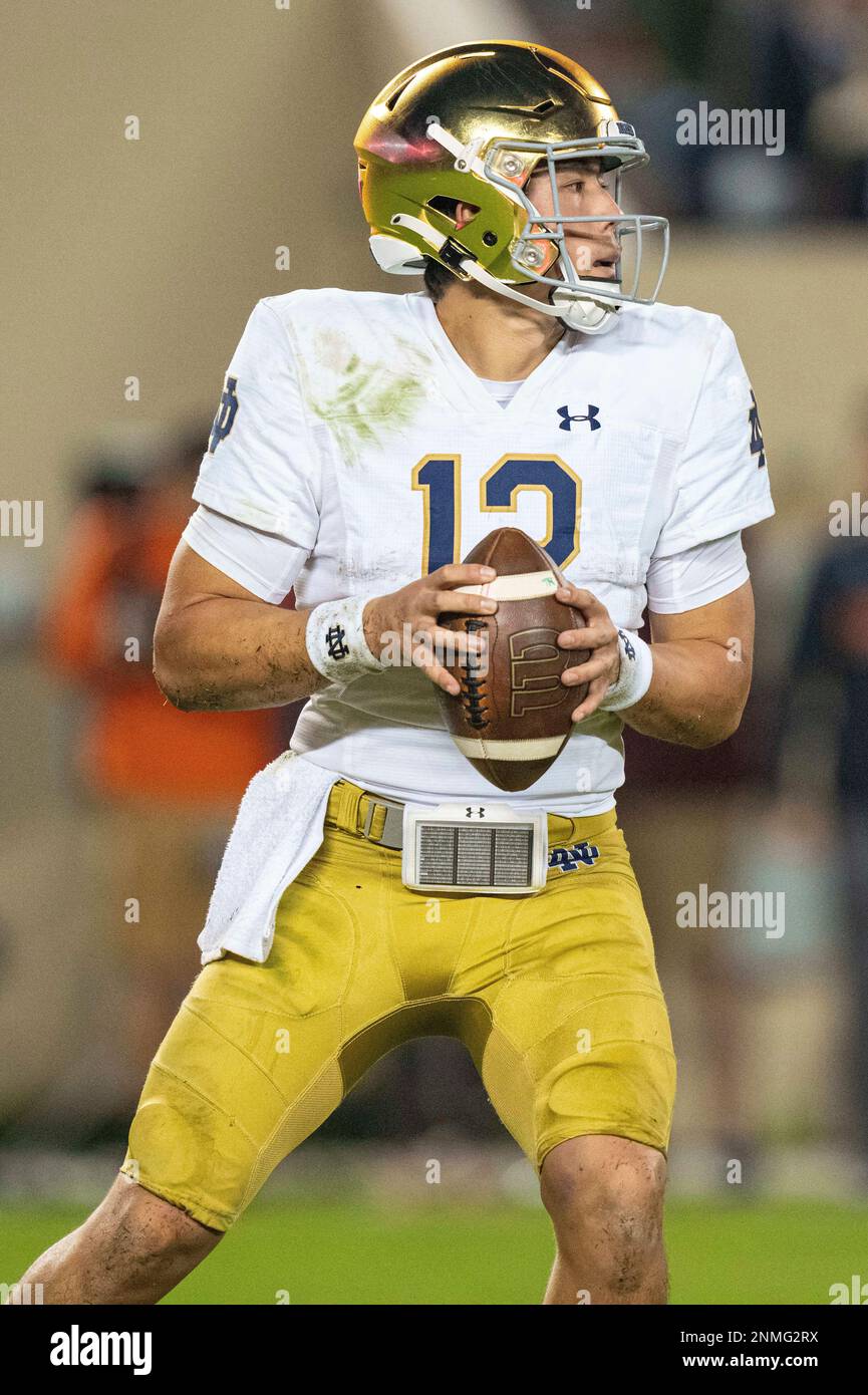 Notre Dame Fighting Irish quarterback Tyler Buchner (12) looks to pass ...