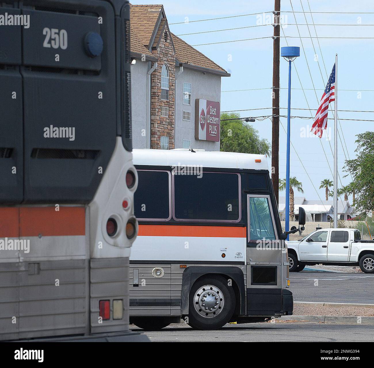 Two of six U.S. Government buses are seen parked outside the Best ...