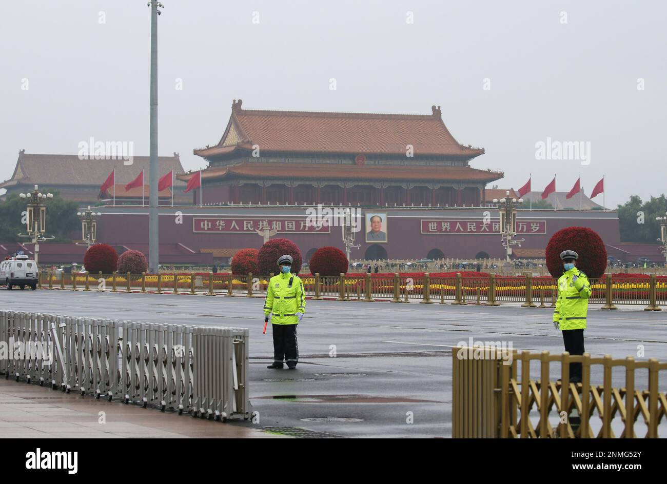 Police officers watch near the Great Hall of the People, a venue for an ...