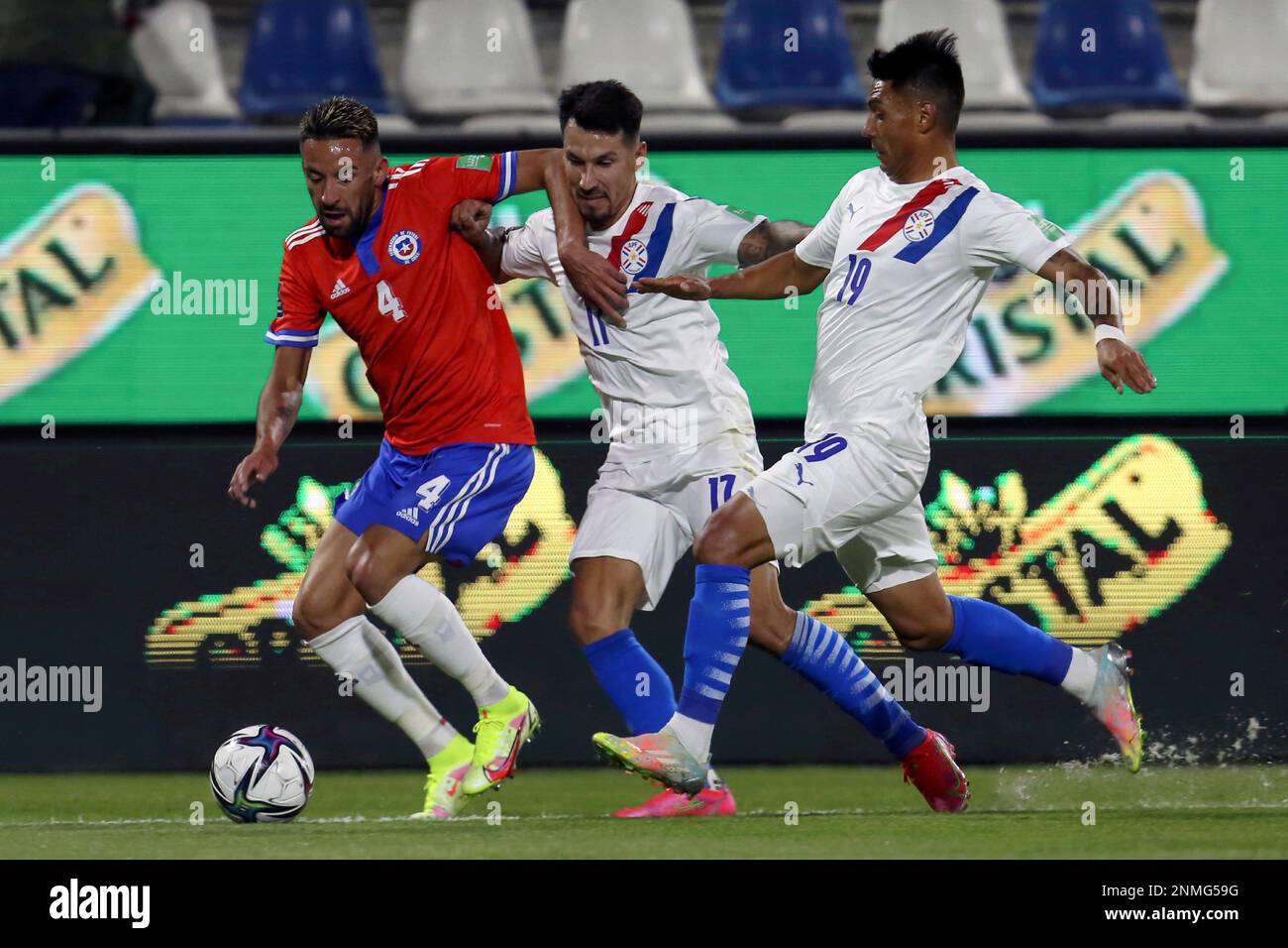 Chile's Mauricio Isla, left, fights for the ball with Paraguay's Hernan ...