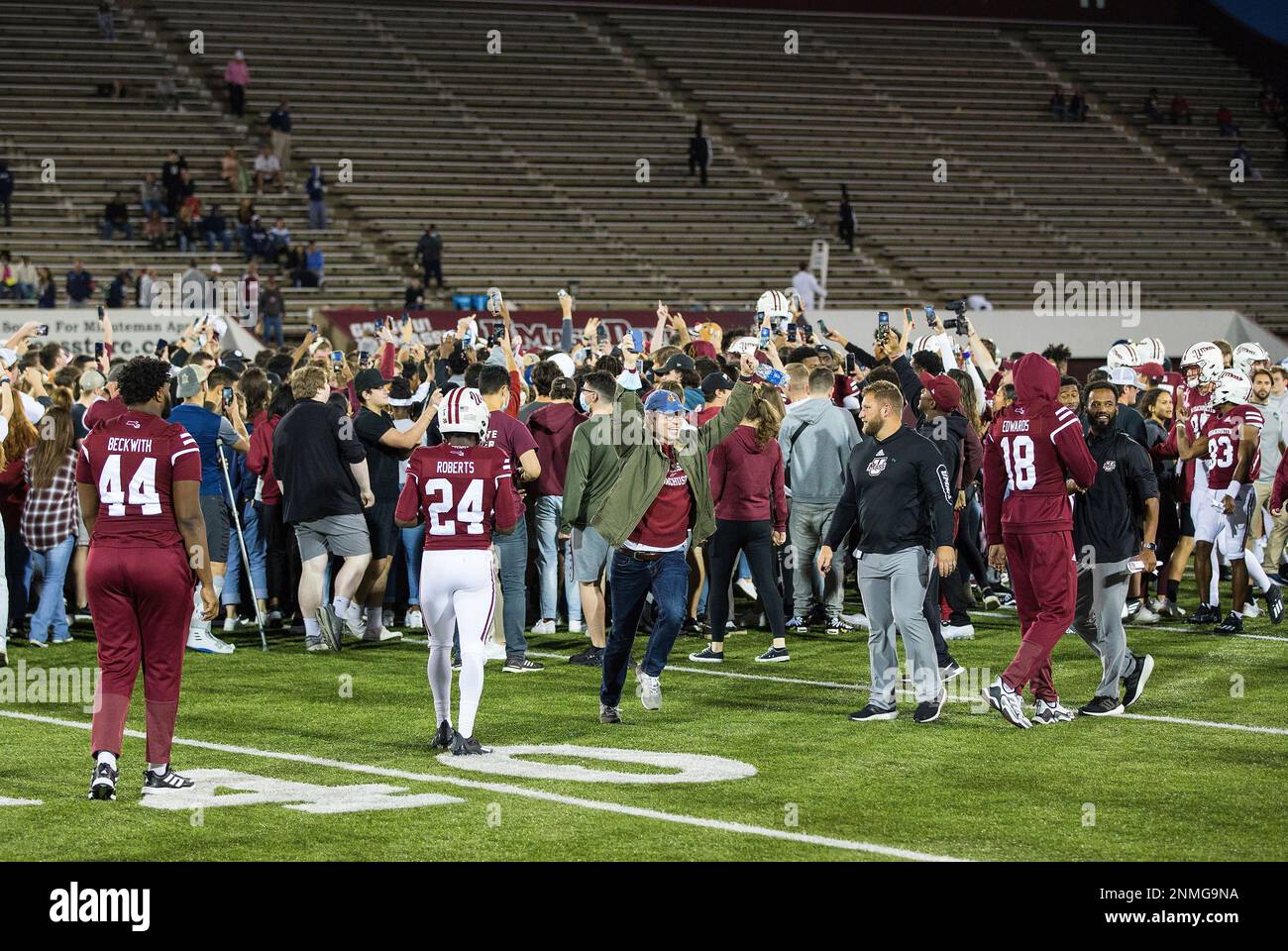 AMHERST, MA - OCTOBER 09: UMass fans storm the field at the conclusion ...