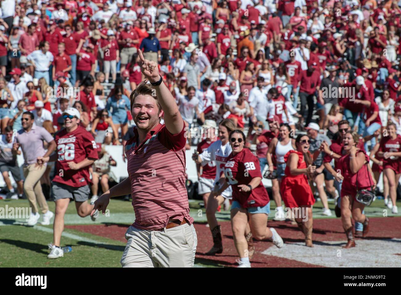 DALLAS, TX - OCTOBER 09: Oklahoma Sooners fans storm the field after ...