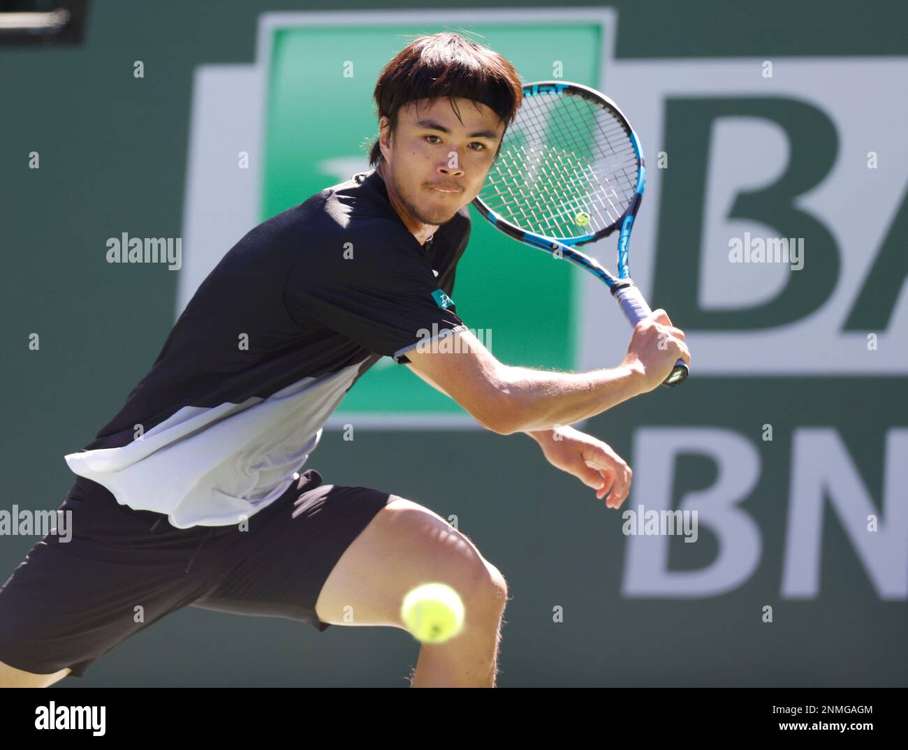 October 09, 2021 Taro Daniel of Japan returns a shot to Reilly Opelka ...