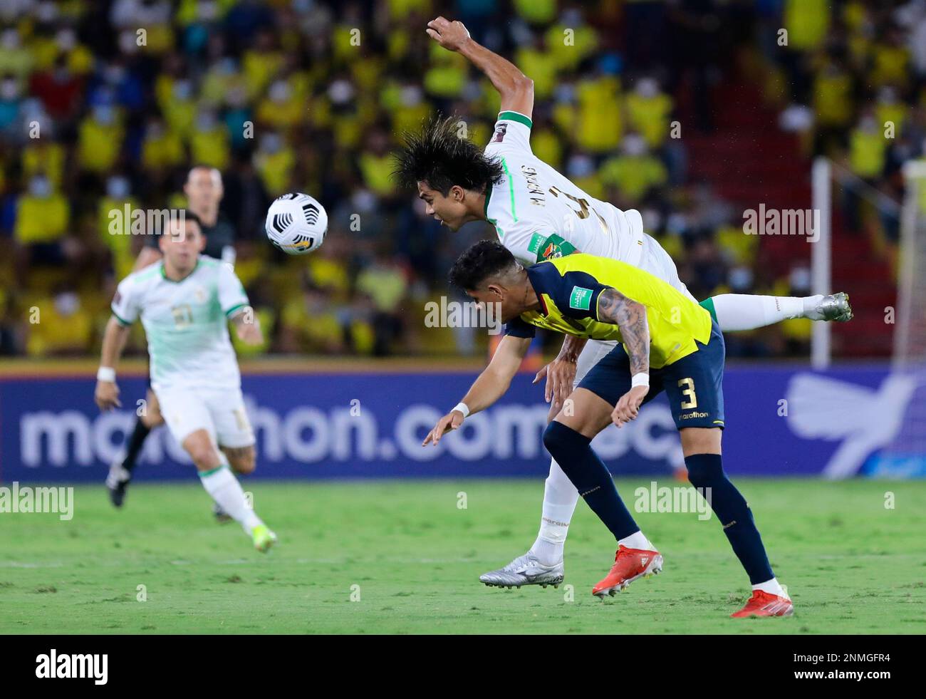Ecuador's Piero Hincapie, front, and Bolivia's Marcelo Martins, go for ...