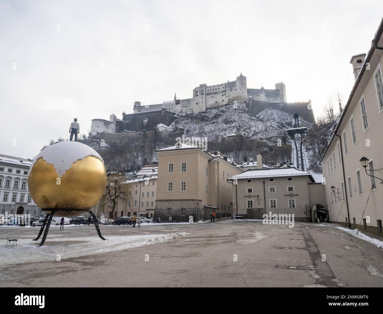 Golden Sphere, sculpture on Kapitelplatz, behind Hohensalzburg Fortress ...