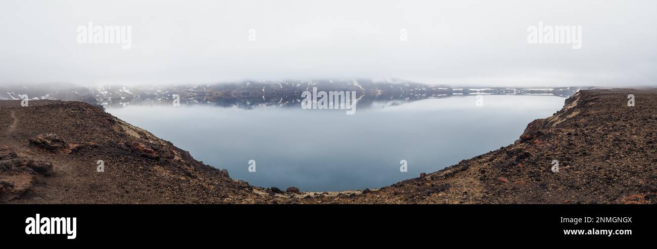 Thick fog over the crater lake Oeskjuvatn, caldera of Askja volcano ...