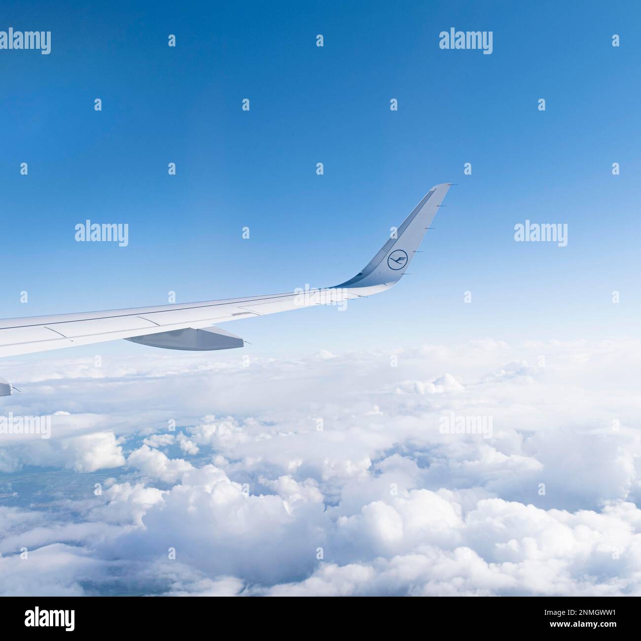 View of the wing of a Lufthansa aircraft over a sea of clouds Stock ...