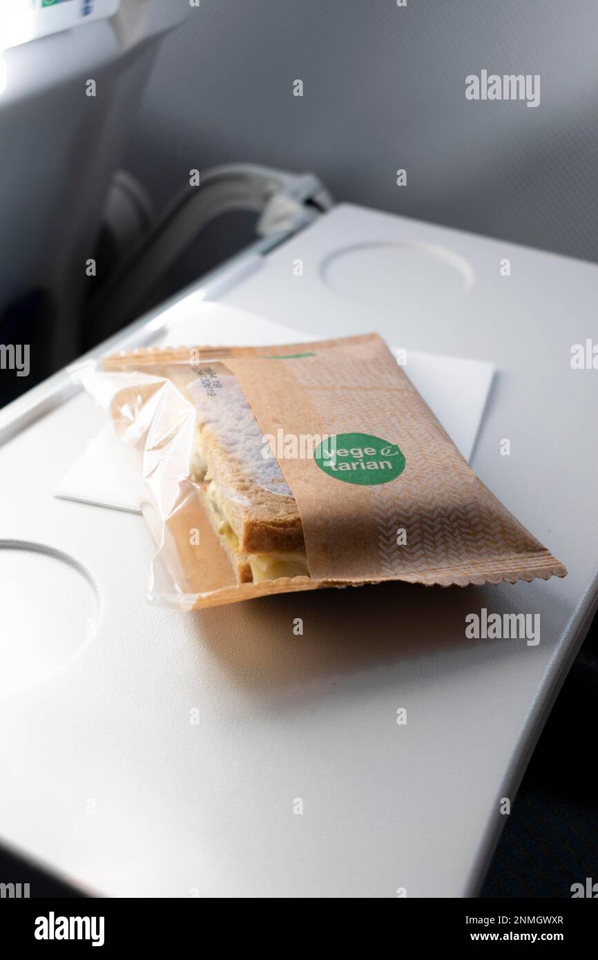 Vegetarian sandwich on a fold-out table on a plane Stock Photo - Alamy