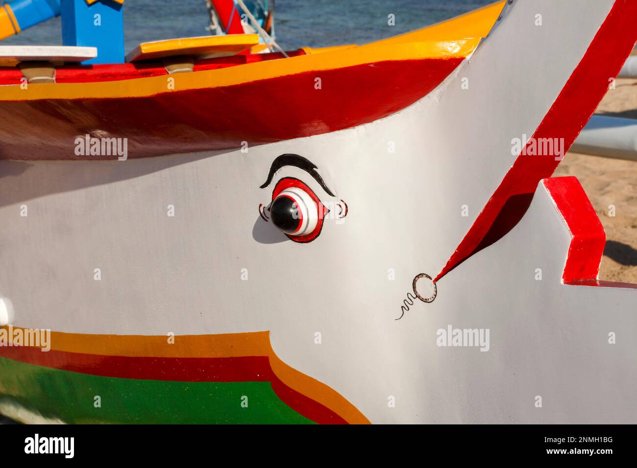 Brightly painted fishing outriggers on the beach at Sanur, Bali ...