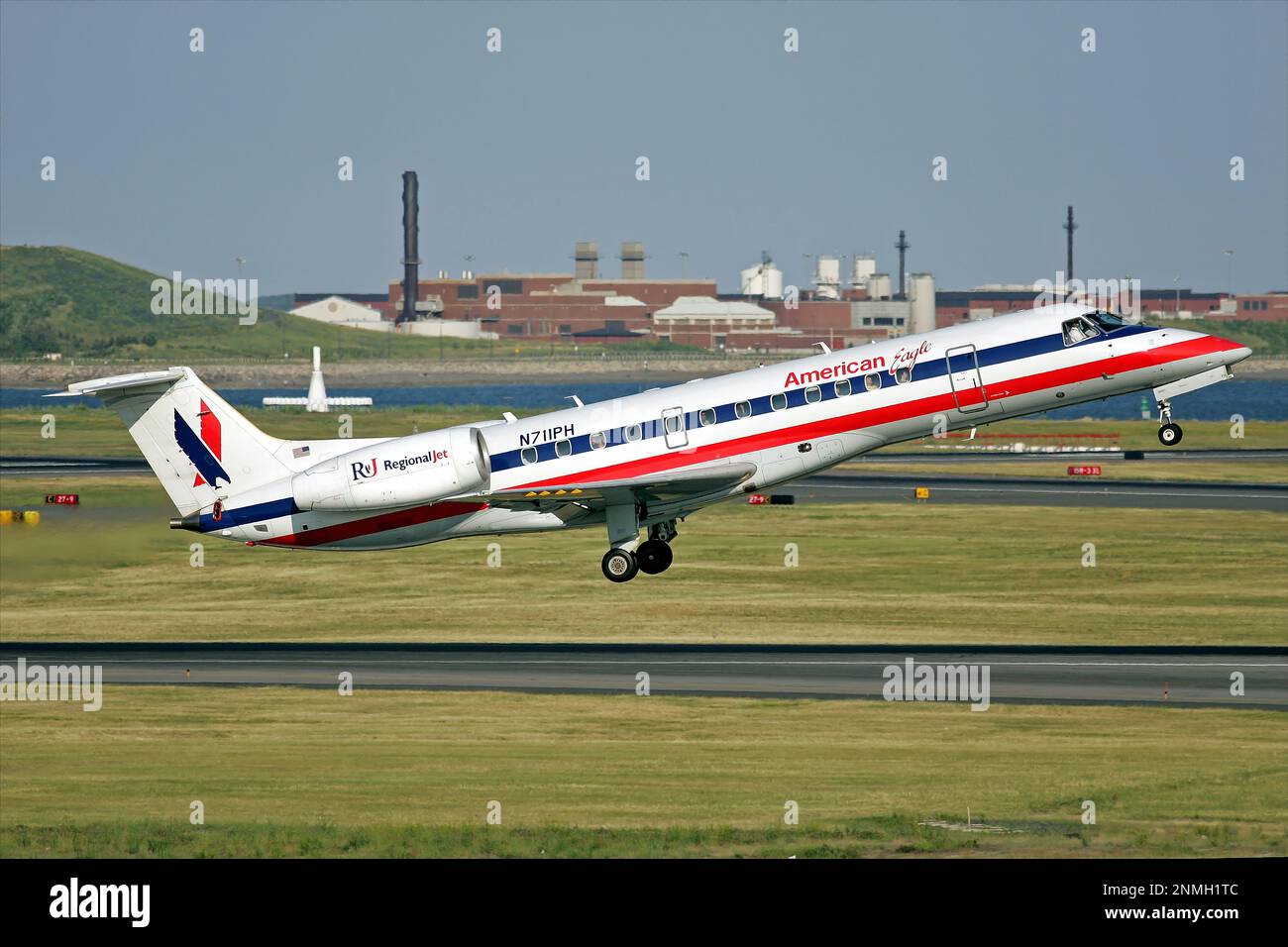 American Eagle airlines small regional jet plane taking off from ...