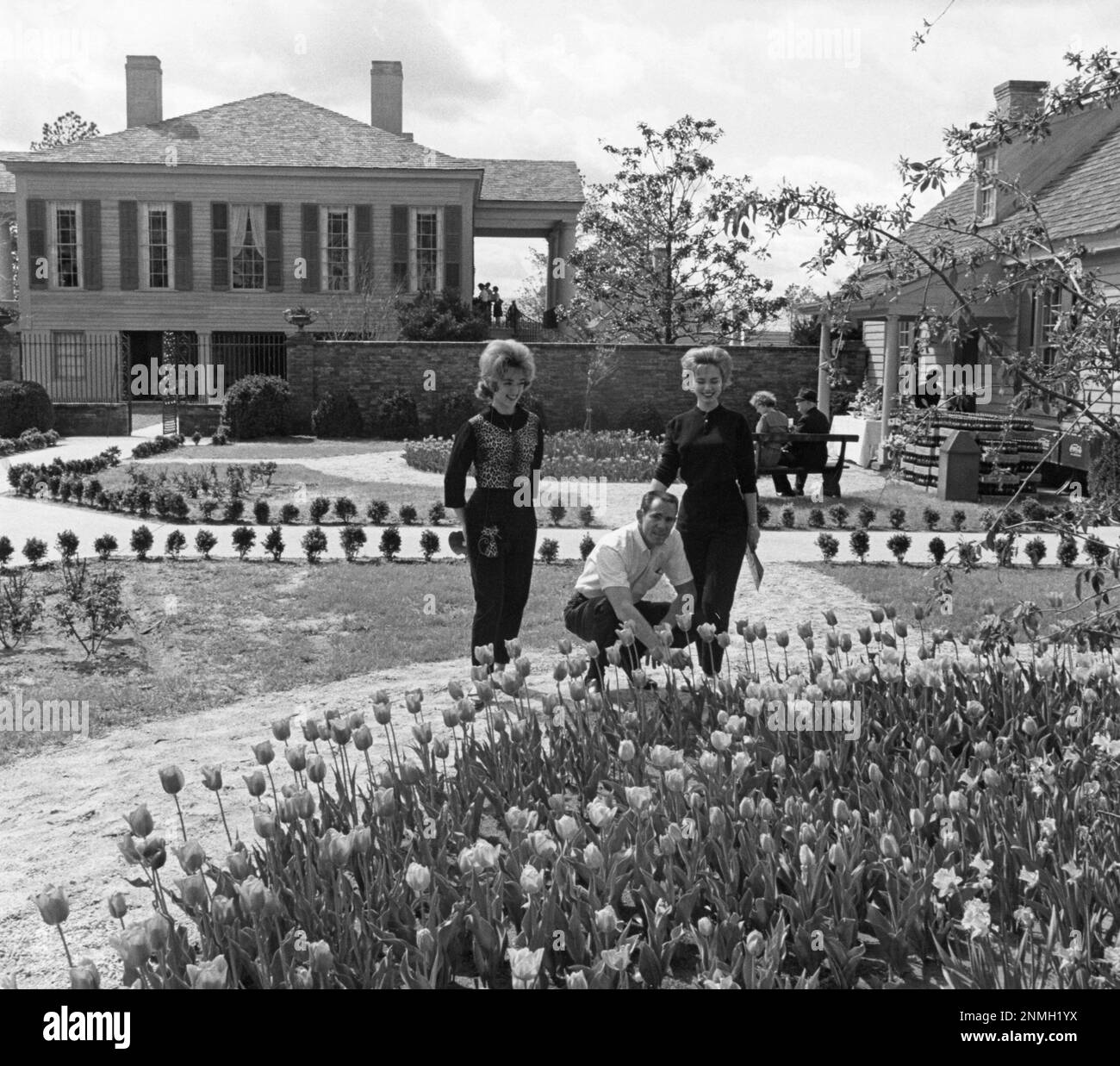 Visitors take a tour through the gardens of Magnolia Hall at Stone ...