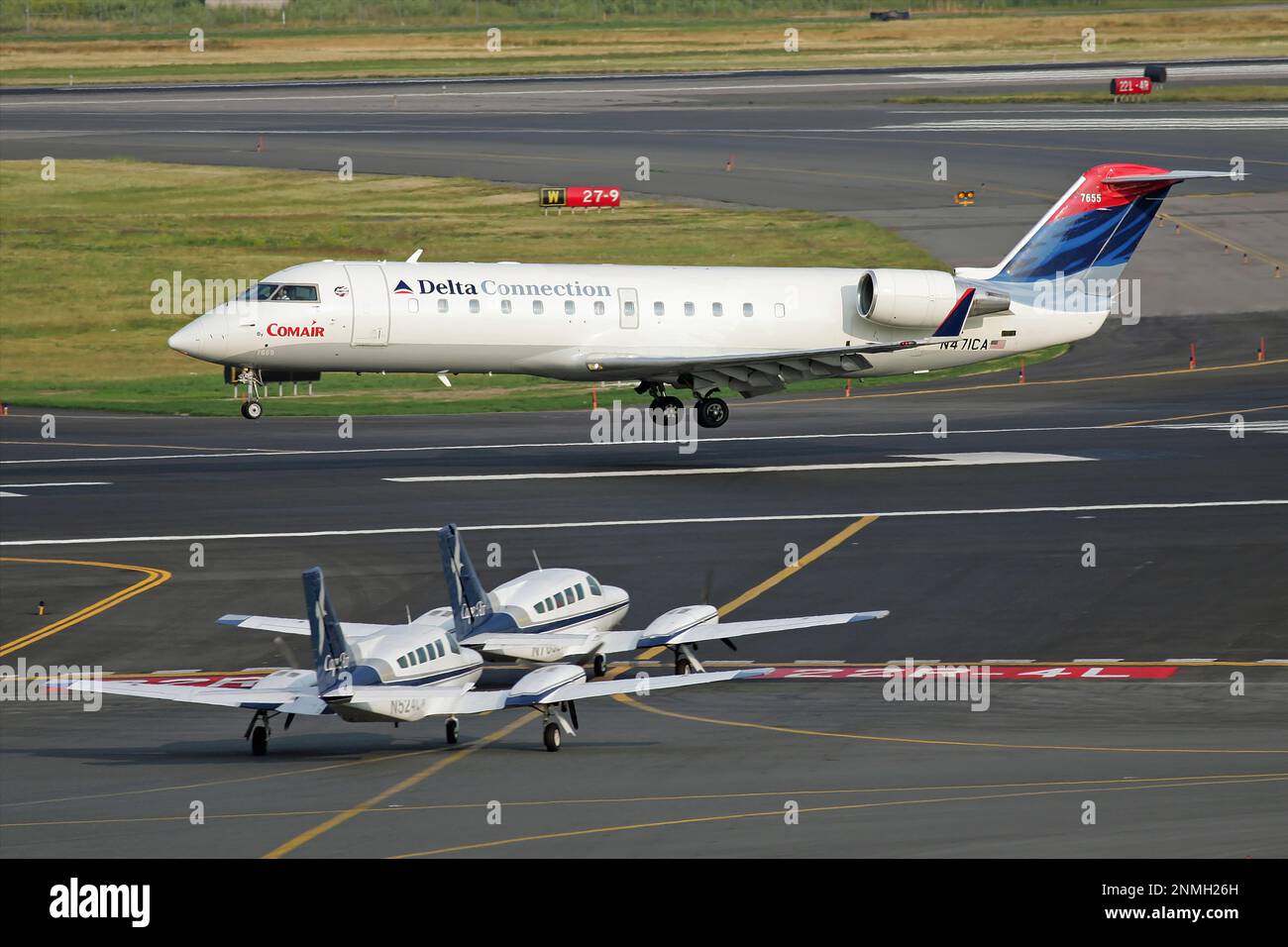 Delta Connection Airlines Comair jet plane, airport runway arrival ...