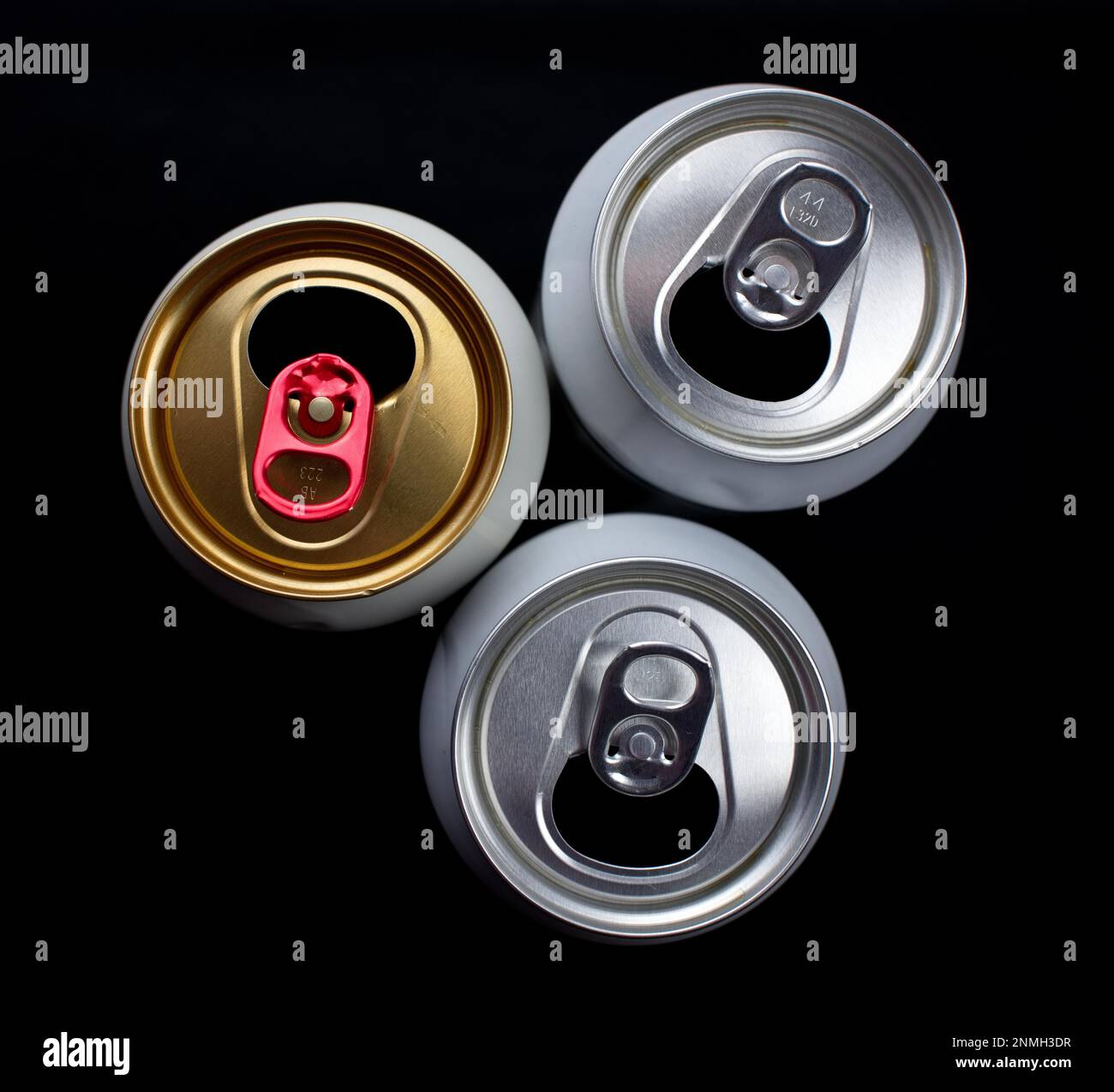 Three opened beer cans Stock Photo - Alamy
