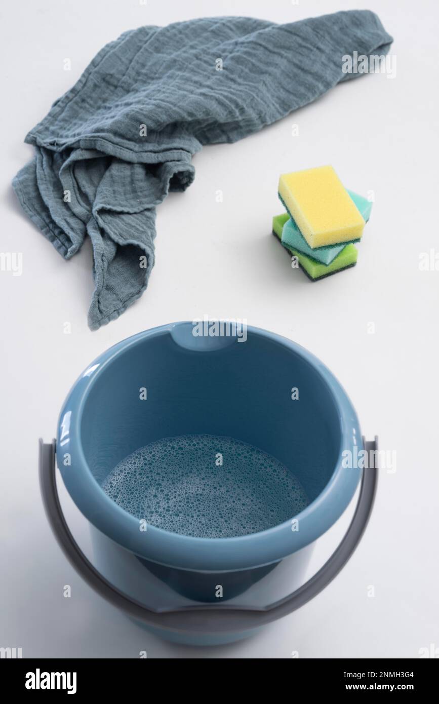 Cleaning bucket, with cleaning cloths and sponges Stock Photo - Alamy