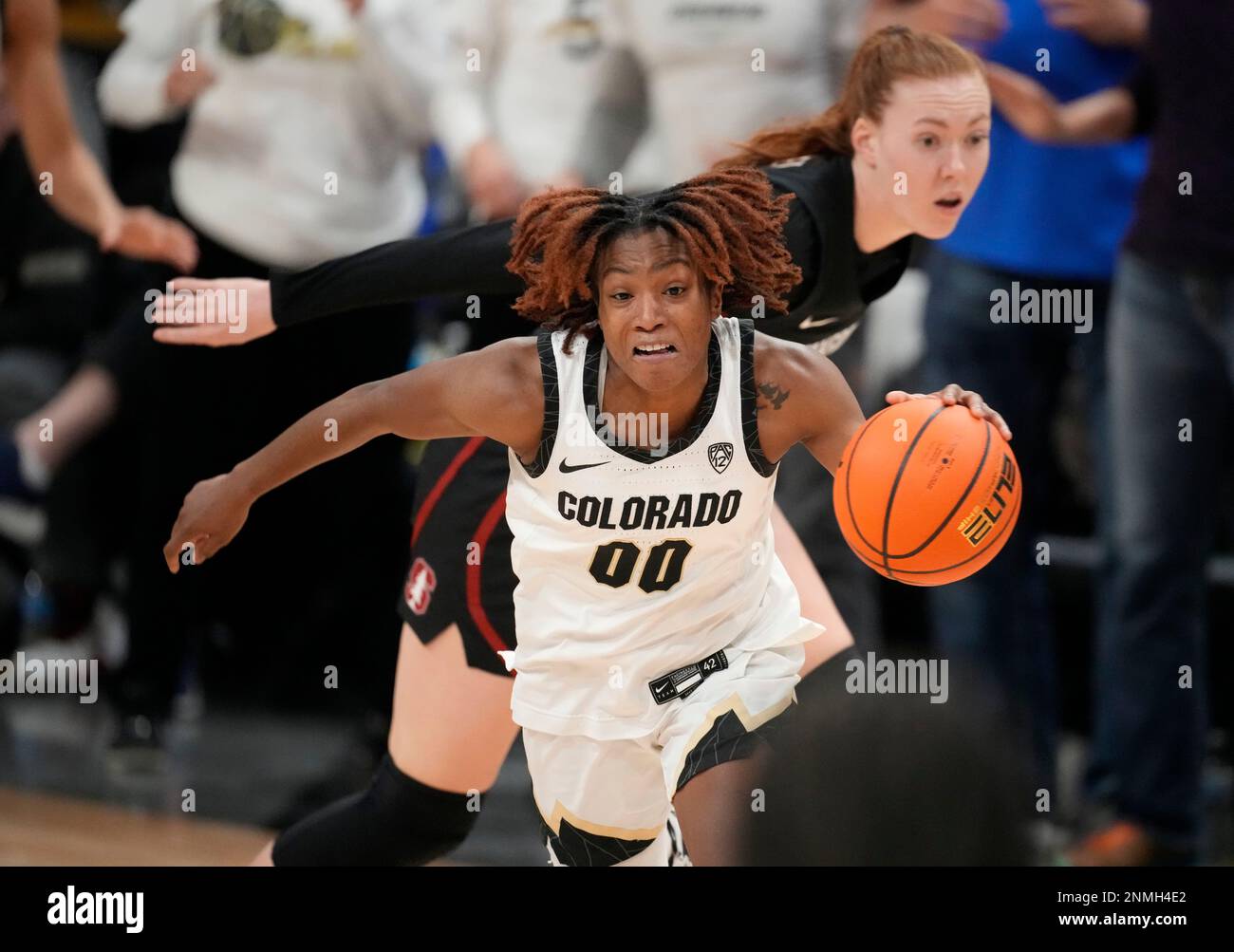 Colorado guard Jaylyn Sherrod (00) picks up a loose ball in front of ...