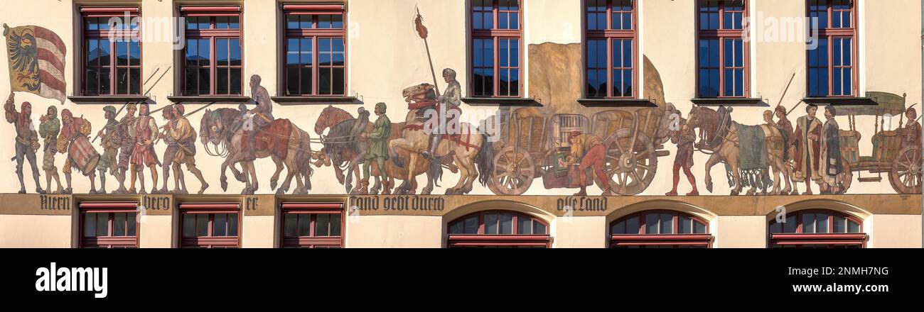 Historical mural of a medieval merchant procession, facade of the ...