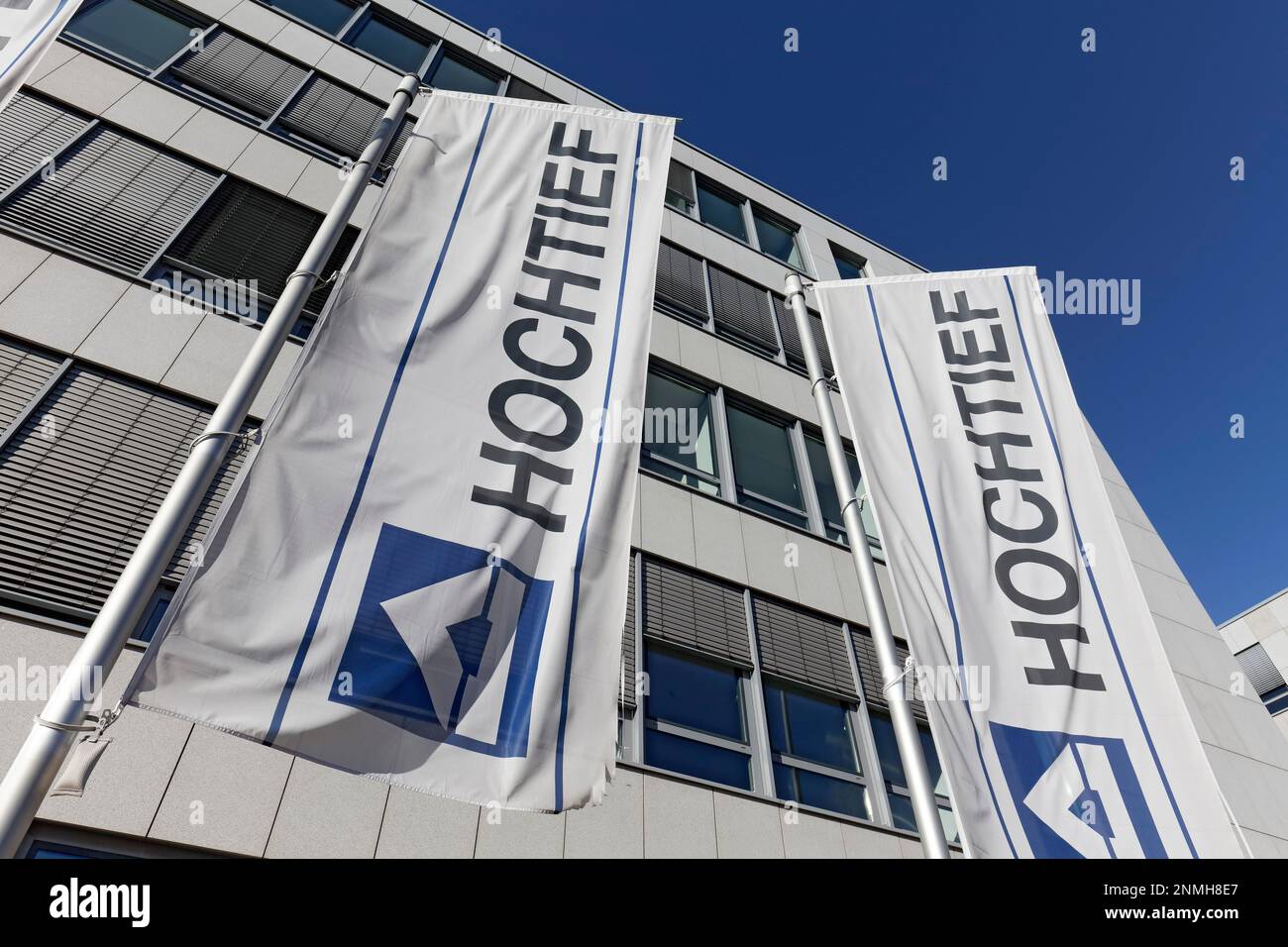 Hochtief AG, flags with logo at company headquarters, construction ...