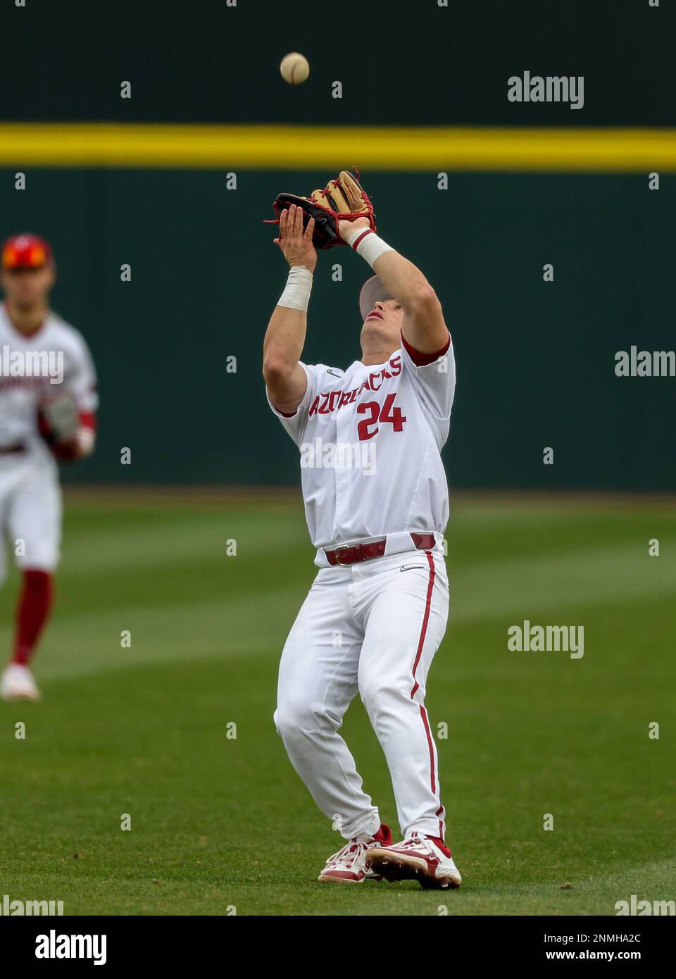 February 24, 2023: Razorback infielder Peyton Holt #24 settles under a ...