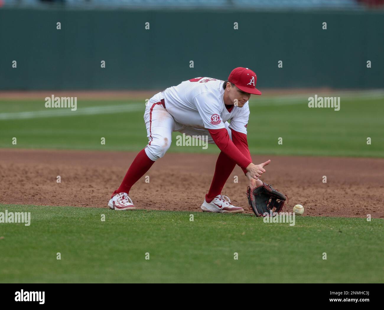 February 24, 2023: Brady Slavens #17 of Arkansas goes down on a ball ...