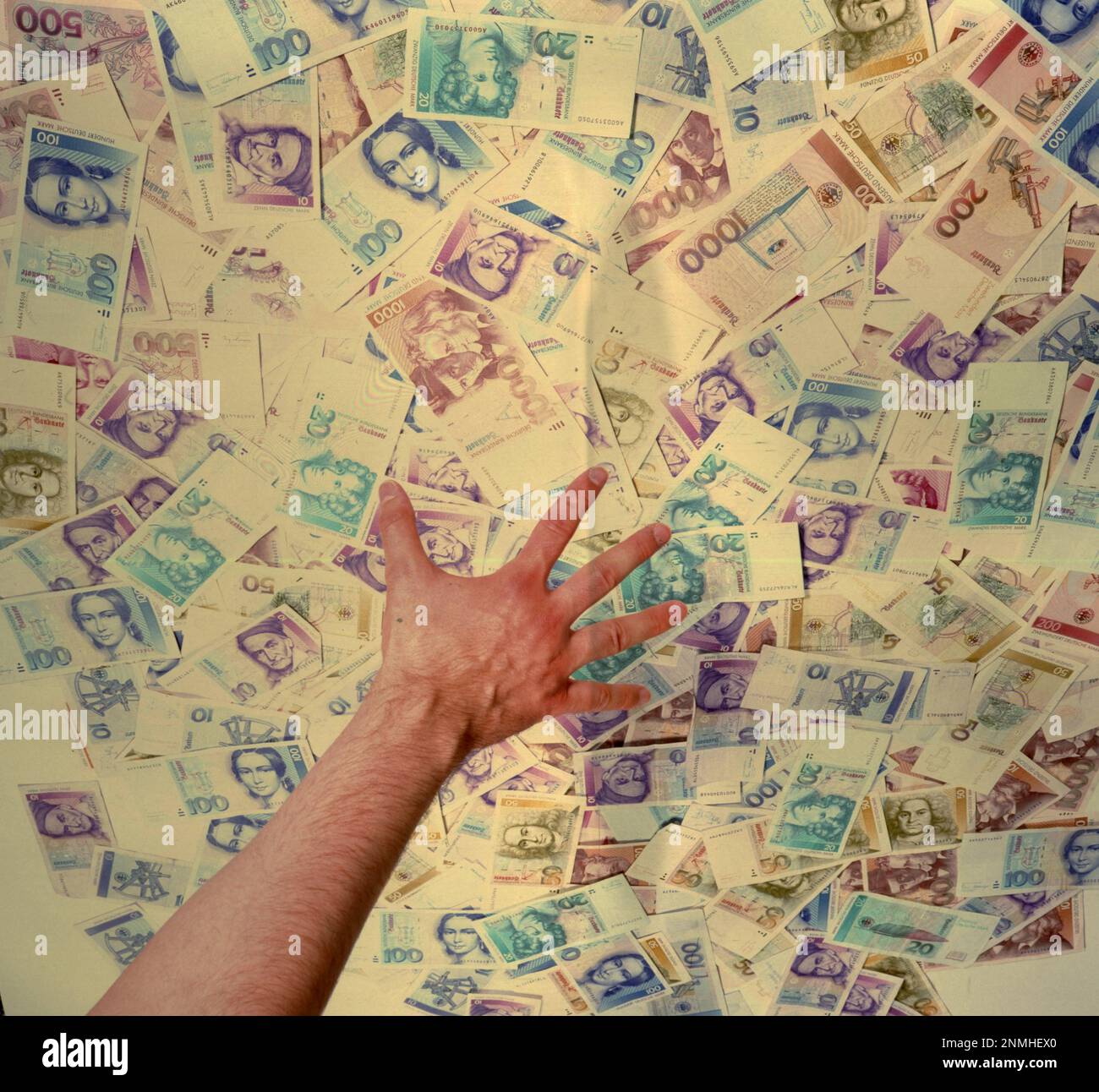 Symbolic image of money in DM notes and coins, here on 13.9.1993, DEU ...