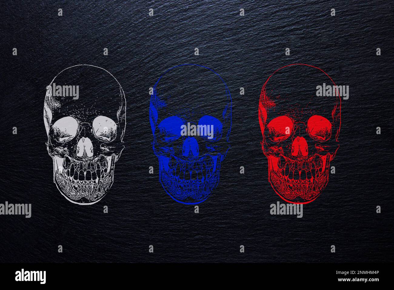Three graphic skulls in the Russian national colours, on a black slate ...