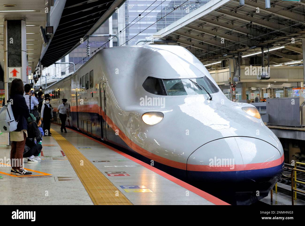 Many people take pictures of E4 Series Shinkansen bullet train at Tokyo Station in Tokyo on Oct ...