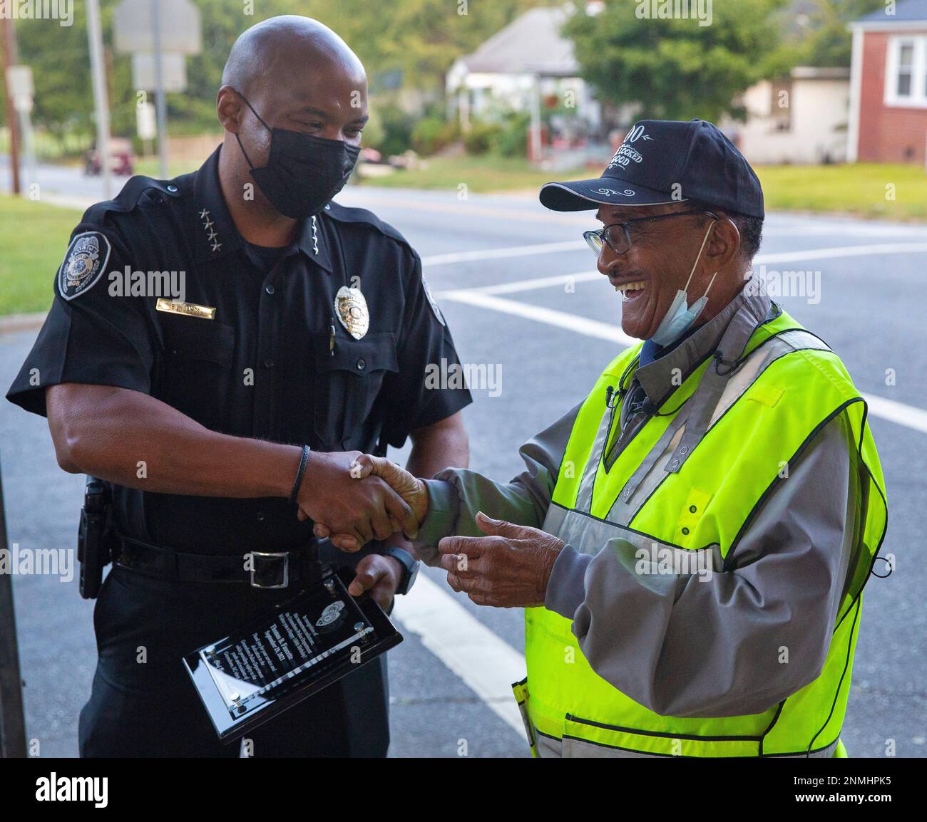 Greensboro Police Chief Brian James shakes hands with Thomas Faucette ...