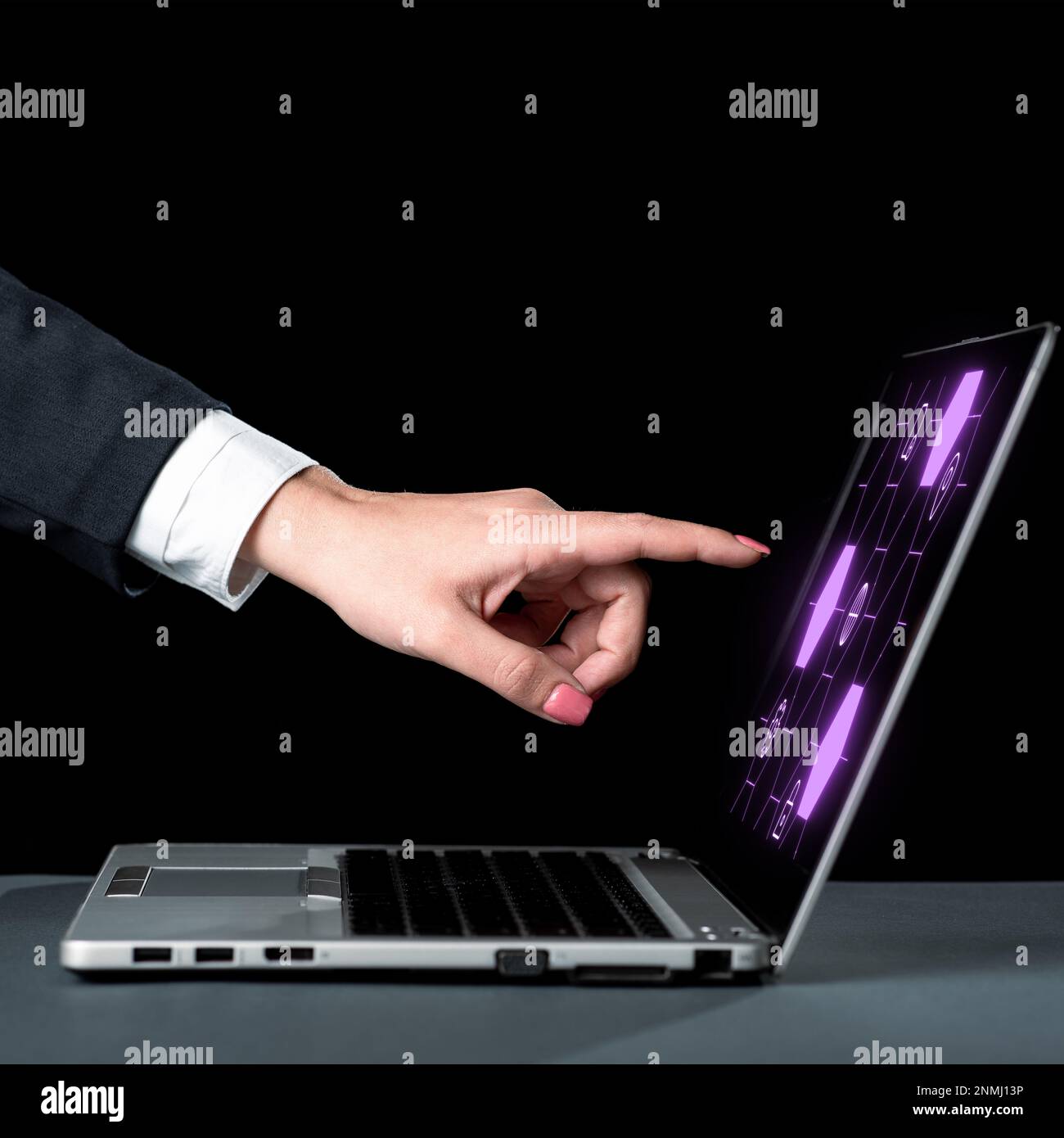 Finger pointing to laptop screen with important technology news ...