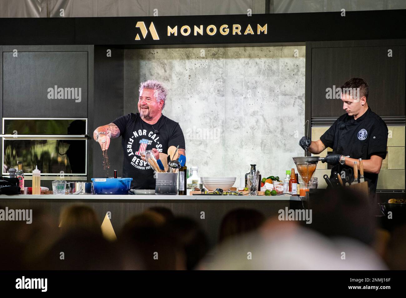 Guy Fieri adds seasoning to his vegan dish with his son Hunter Fieri at ...