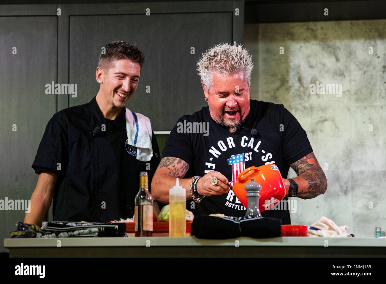 Guy Fieri and his son Hunter Fieri spoon cashew vegan cheese onto his ...