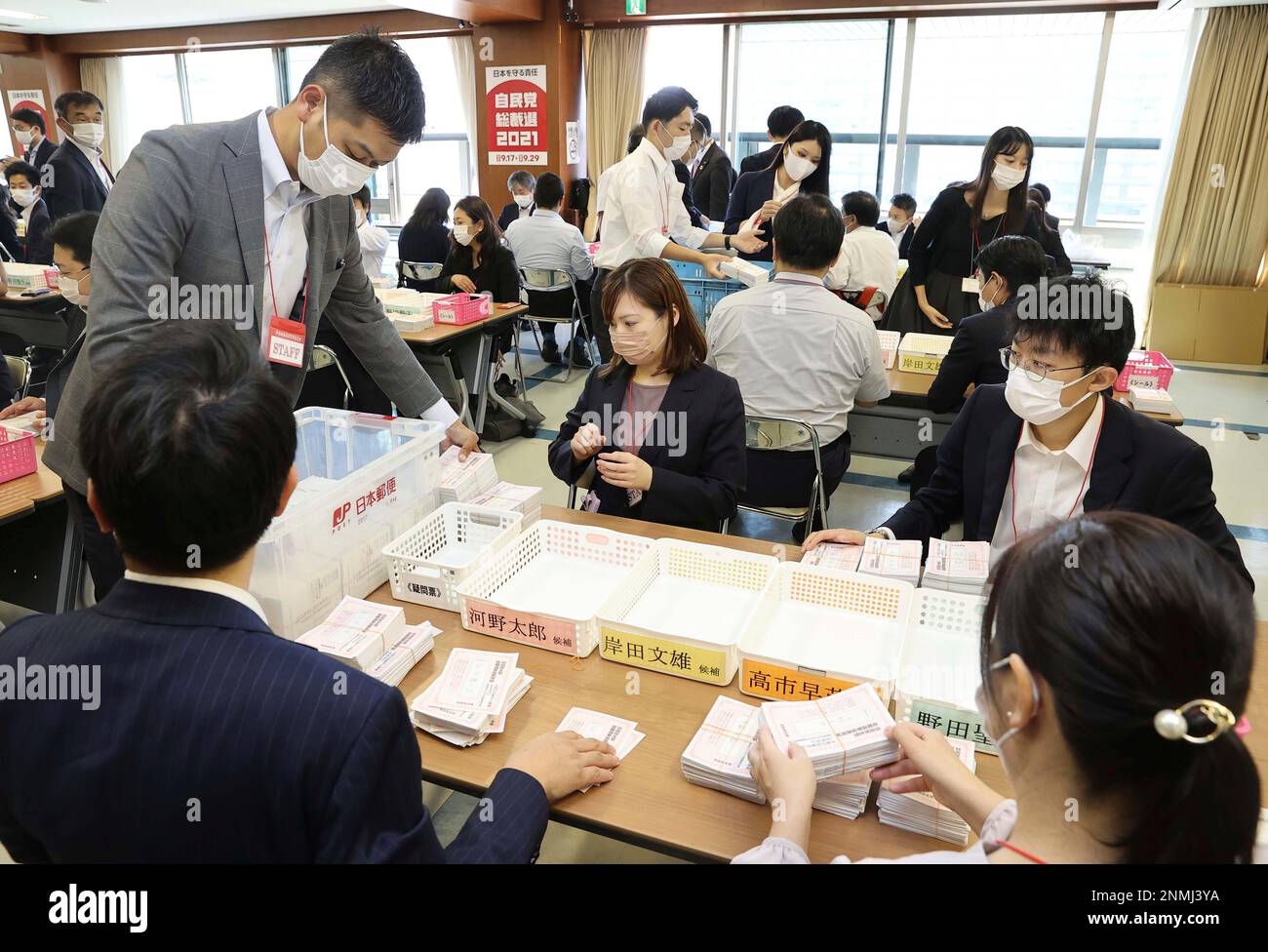 Liberal Democratic Party (LDP) officials open the polls of party ...